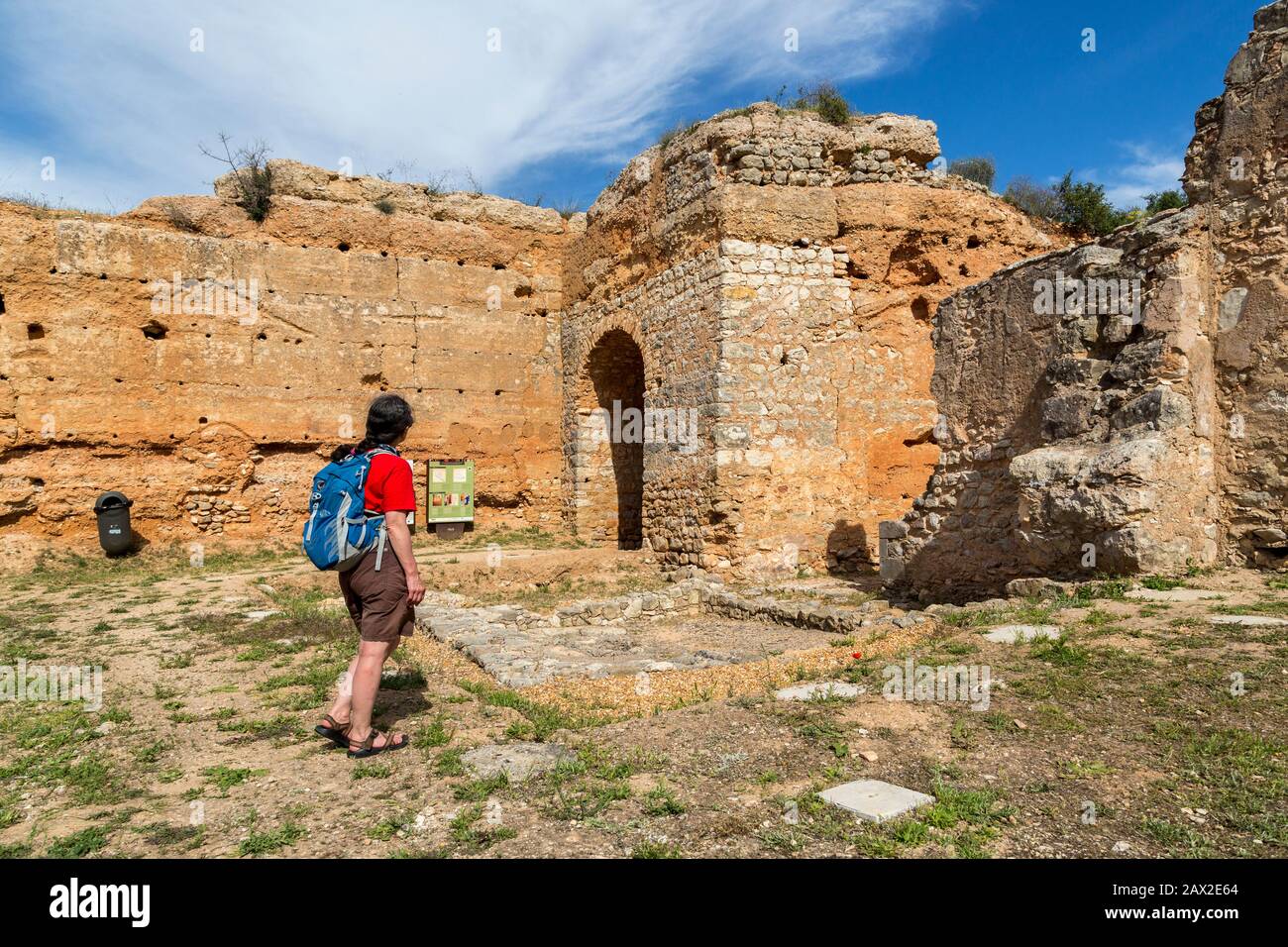 Tourist at entrance gateway to Paderne Moorish castle, Paderne, Algarve ...