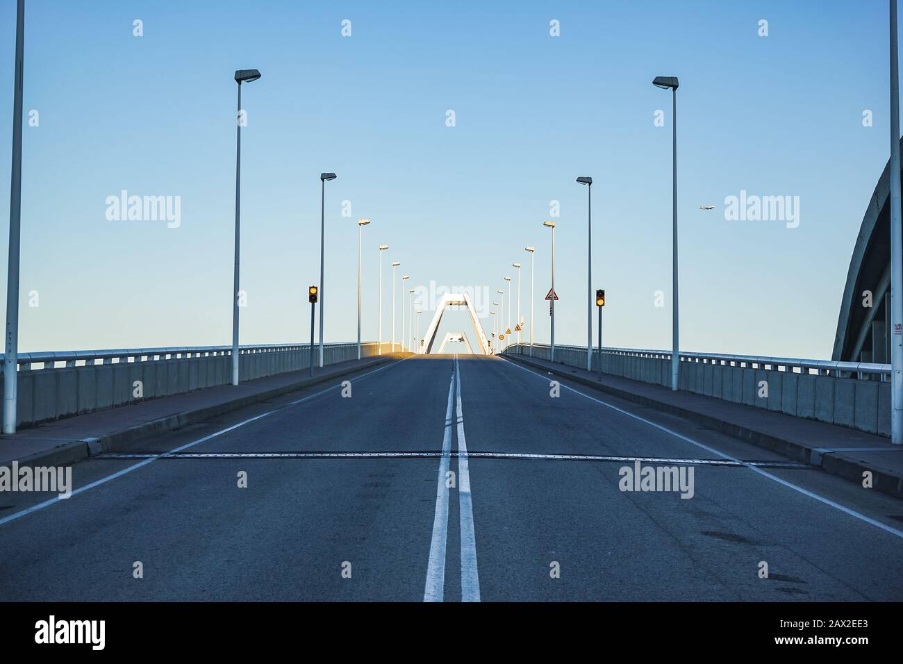 Afternoon lights on the end of an empty bridge Stock Photo - Alamy