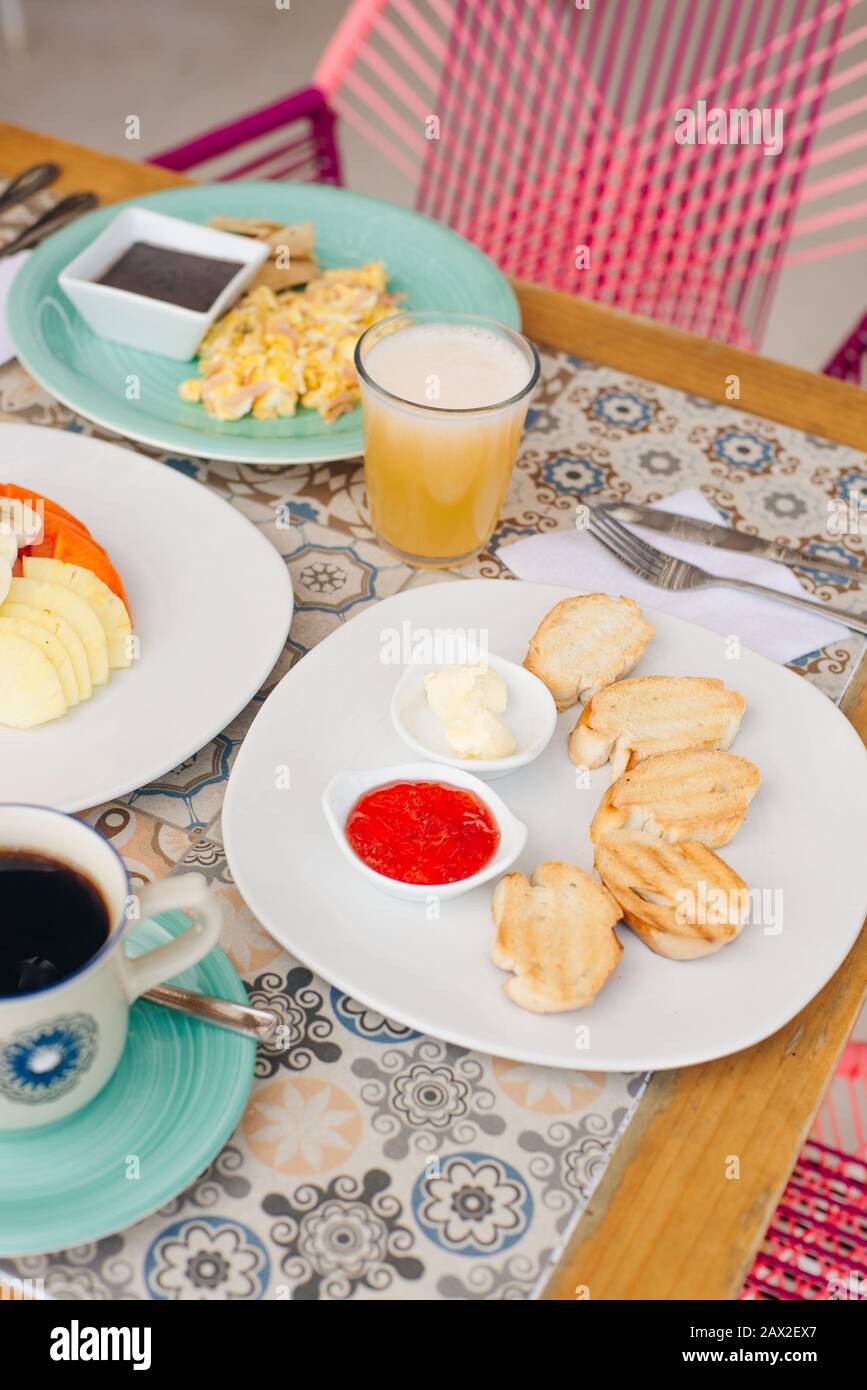 breakfast for two in the hotel with eggs, toast and fruit Stock Photo ...
