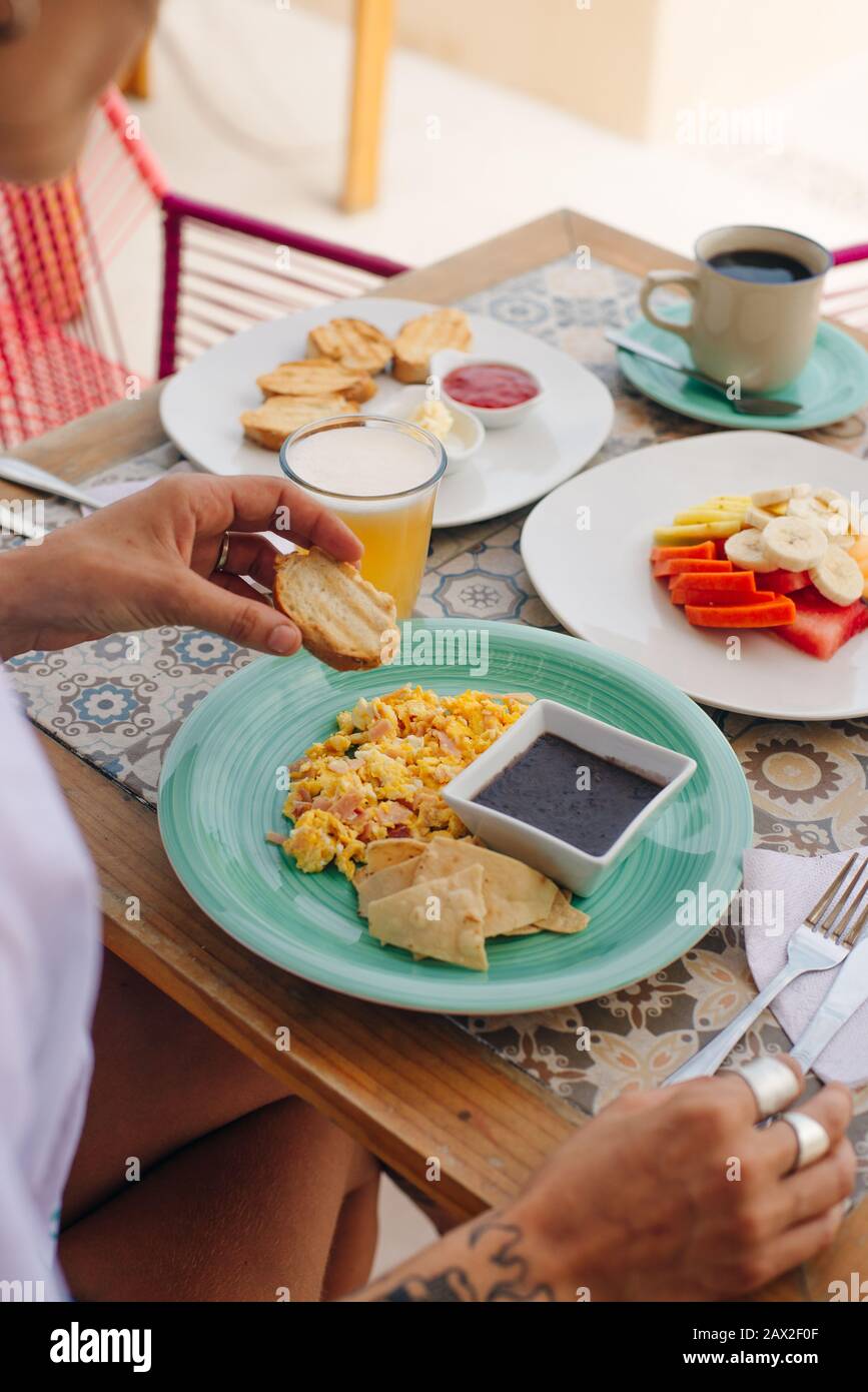 breakfast for tourist in the hotel with eggs, toast and fruit Stock ...