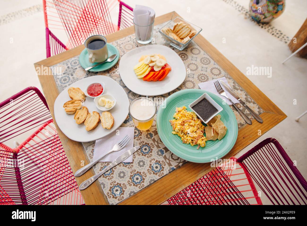 breakfast for two in the hotel with eggs, toast and fruit Stock Photo ...