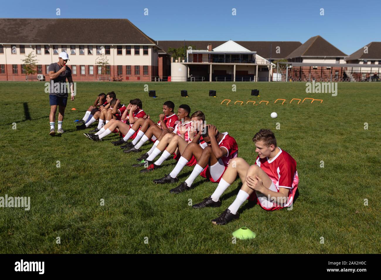 Rugby team doing abs Stock Photo - Alamy