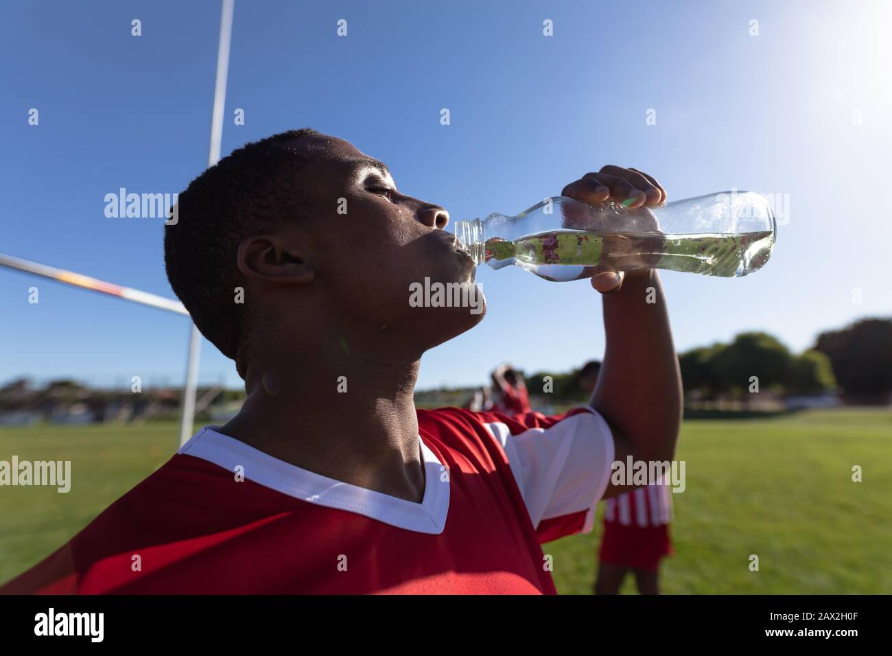 Rugby player drinking water Stock Photo - Alamy