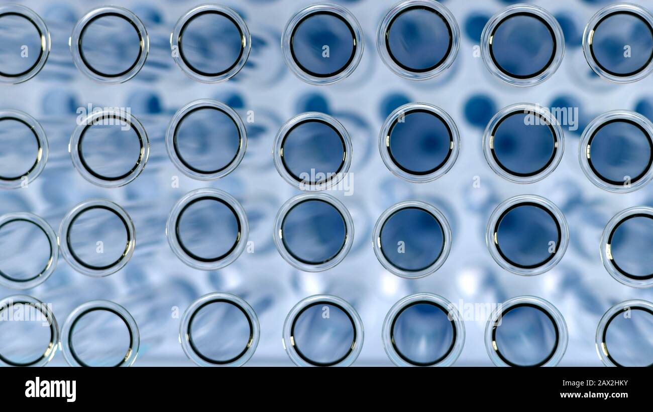 Circles of necks from glass test tubes in blue view from above Stock ...