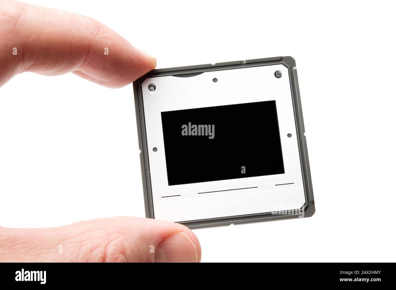 Photo slide in hand isolated on white background Stock Photo - Alamy