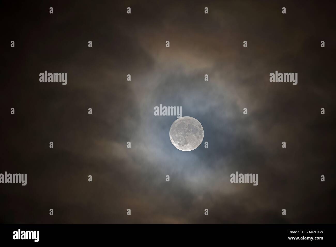 Full moon with coloured clouds Stock Photo - Alamy