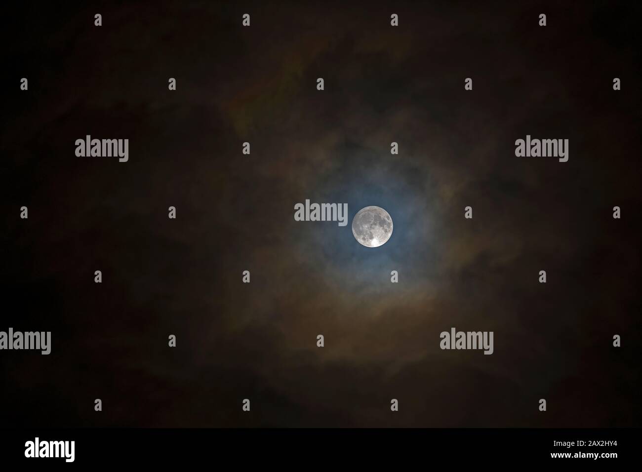 Full moon with coloured clouds Stock Photo - Alamy