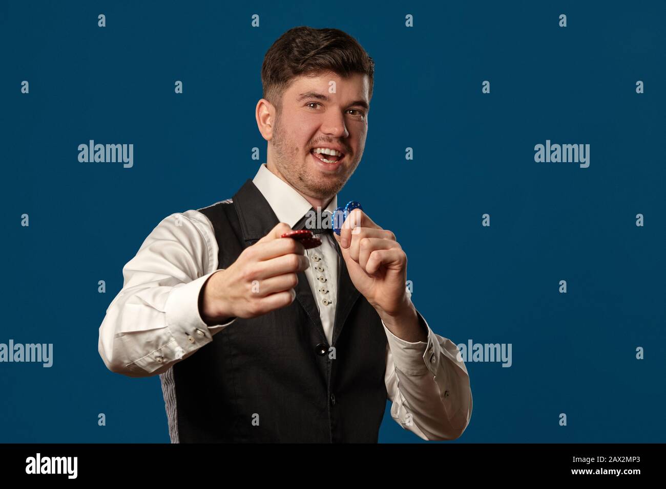 Good-looking fellow, noob in poker, in black vest and white shirt ...