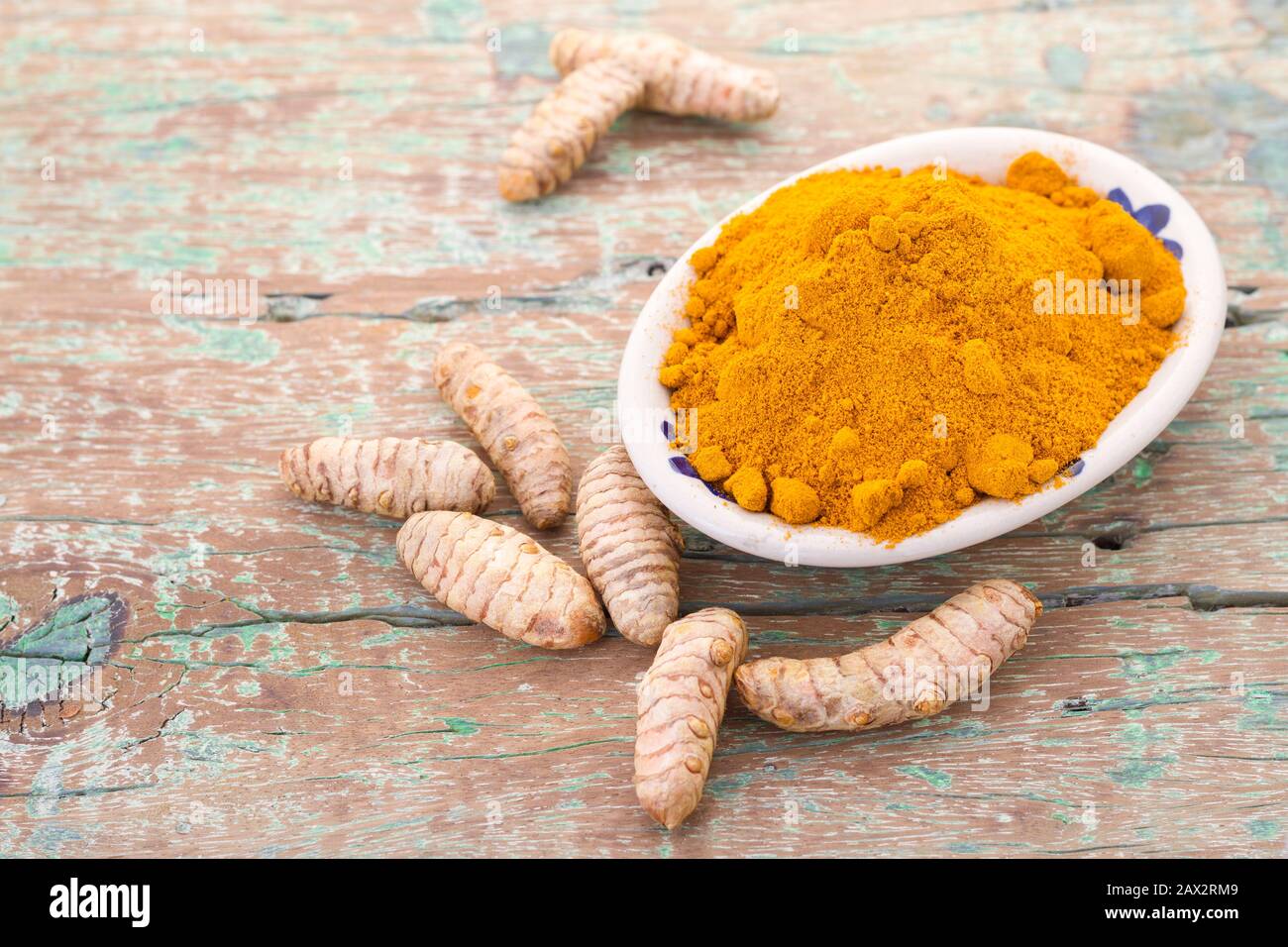 turmeric powder and roots, Asian origin plant containing curcumin has ...