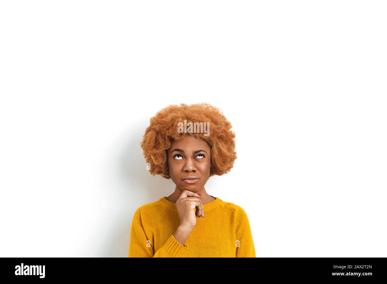 Beautiful African woman is thinking about an idea. Pensive black female ...