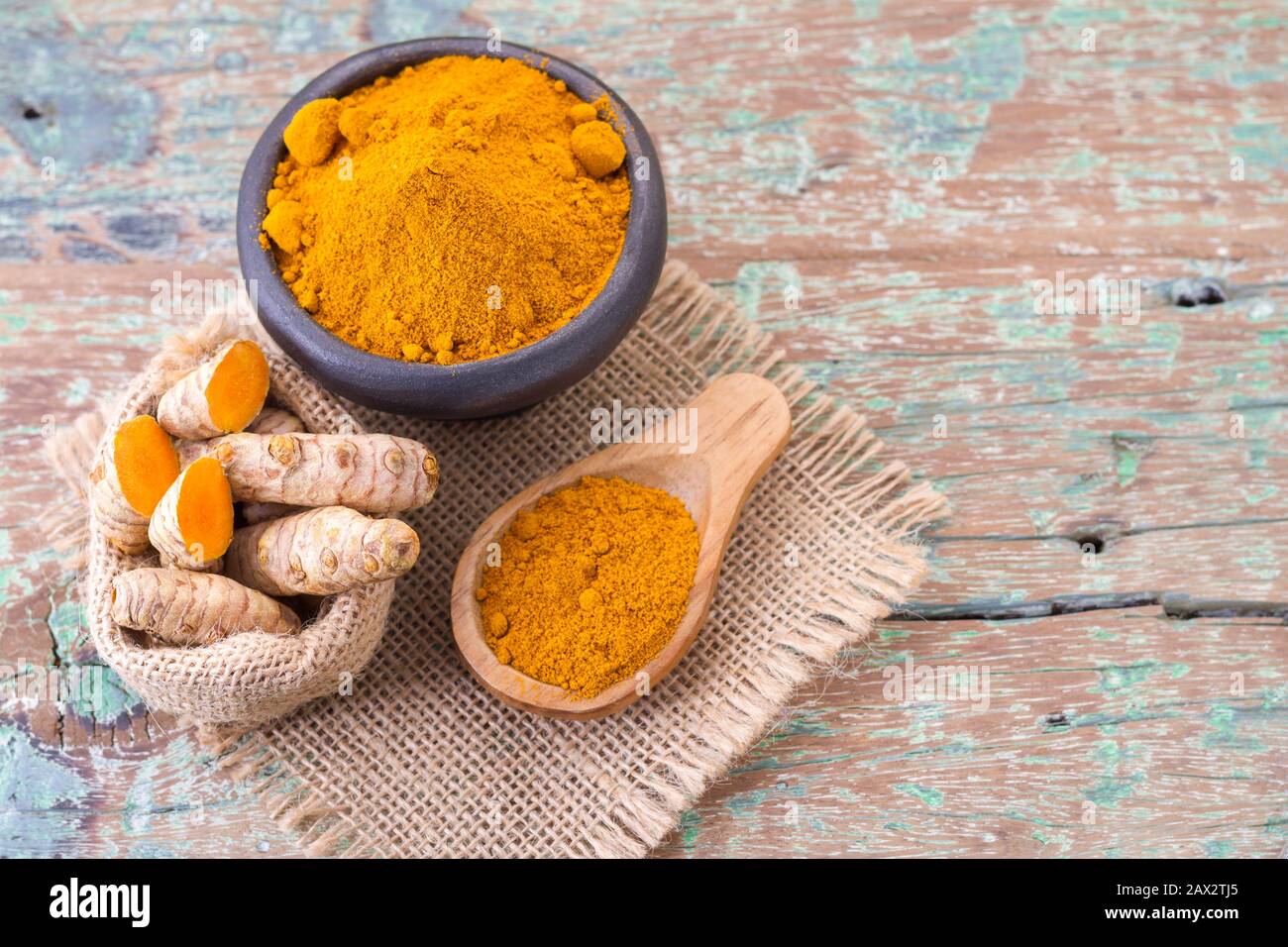turmeric powder and roots, Asian origin plant containing curcumin has ...