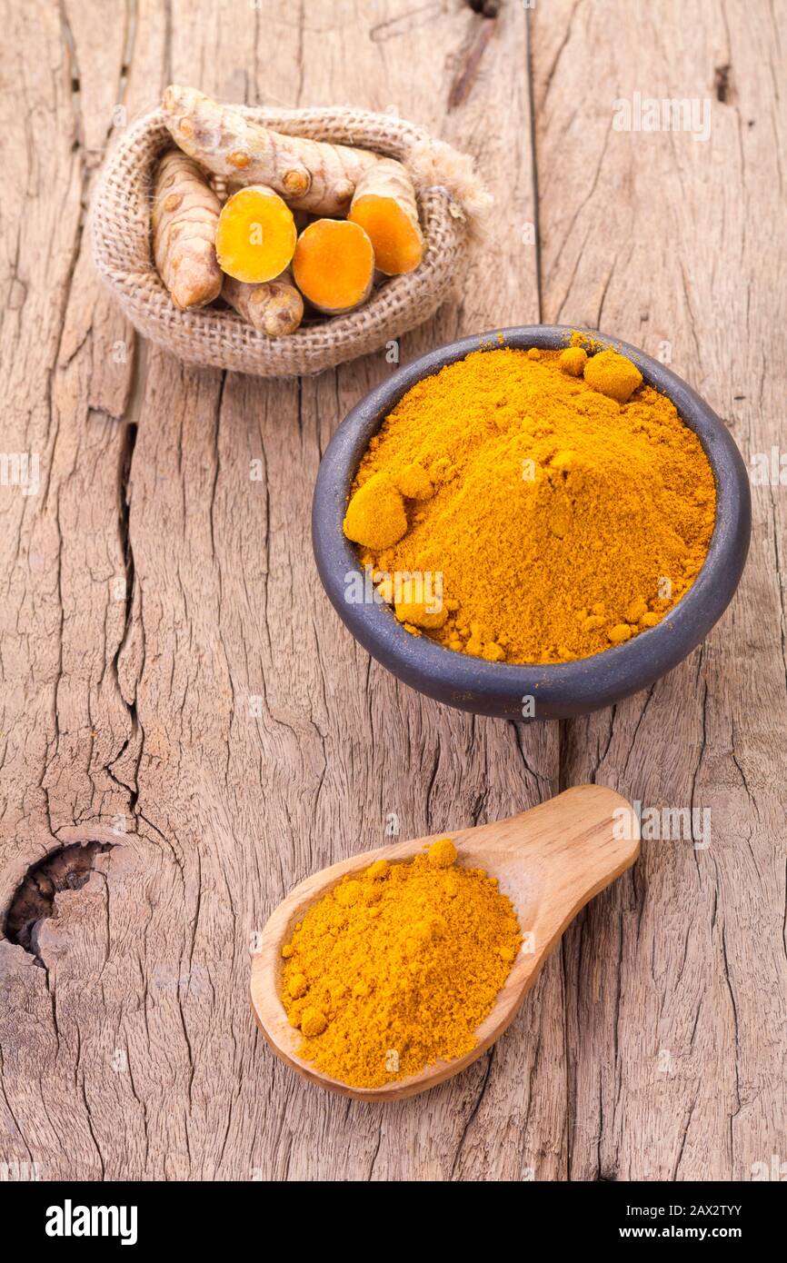 turmeric powder and roots, Asian origin plant containing curcumin has ...