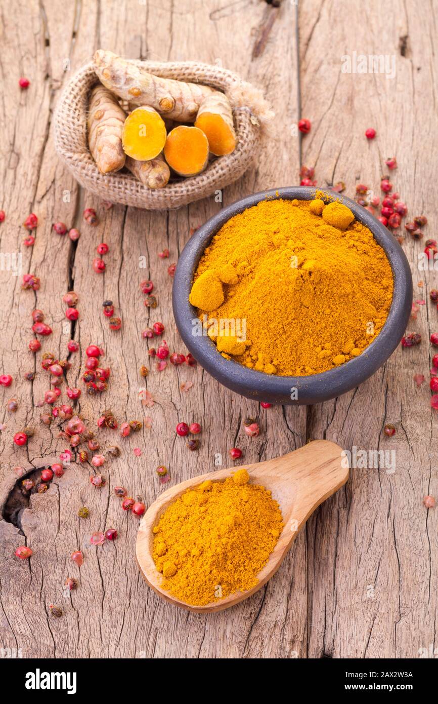 turmeric powder and roots, Asian origin plant containing curcumin has ...