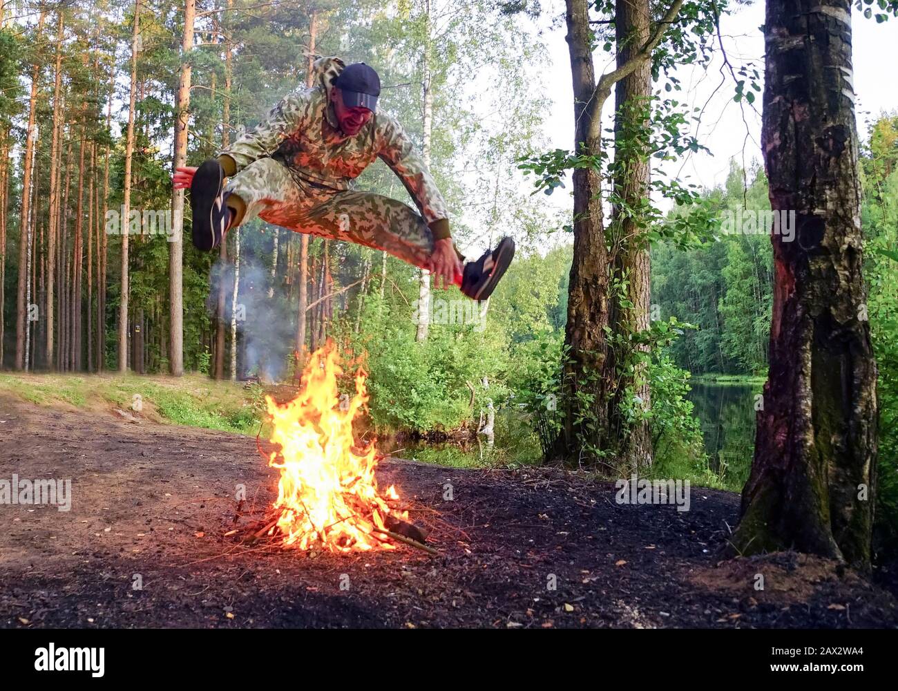 Man jumping over campfire hi-res stock photography and images - Alamy