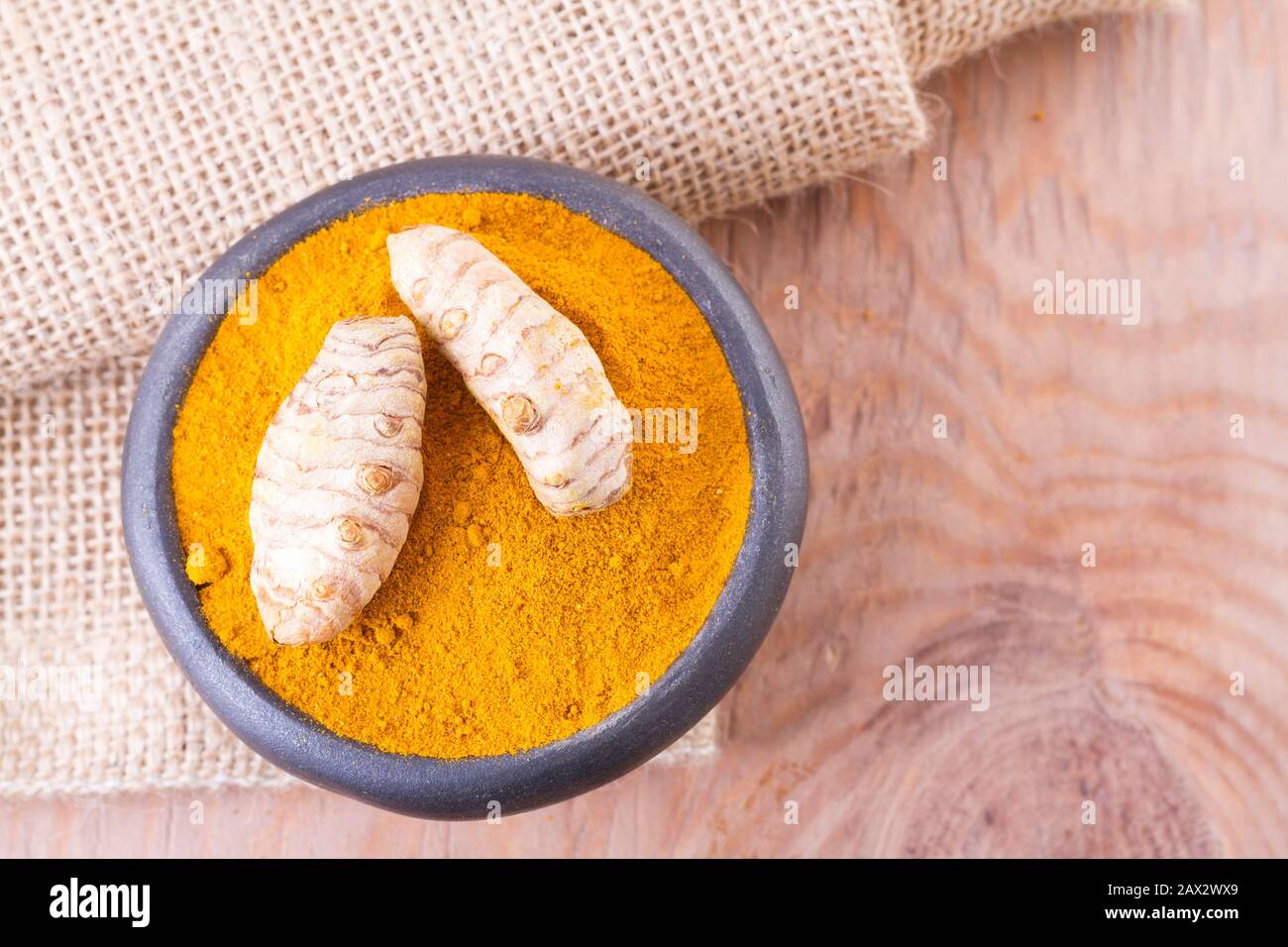 turmeric powder and roots, Asian origin plant containing curcumin has ...