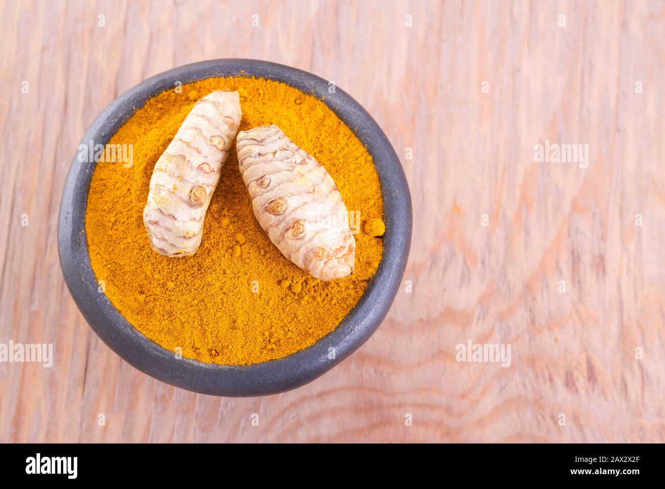 turmeric powder and roots, Asian origin plant containing curcumin has ...