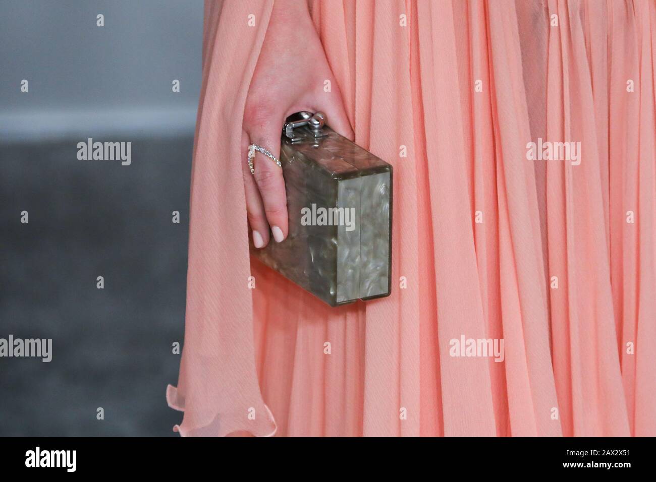 Halston Sage walking on the red carpet at the 2020 Vanity Fair Oscar ...