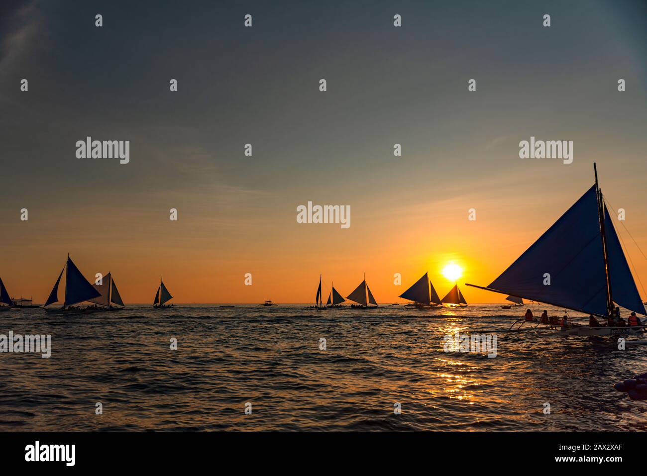 Paraw sailing at Boracay Island, Philippines at Sunset Stock Photo - Alamy