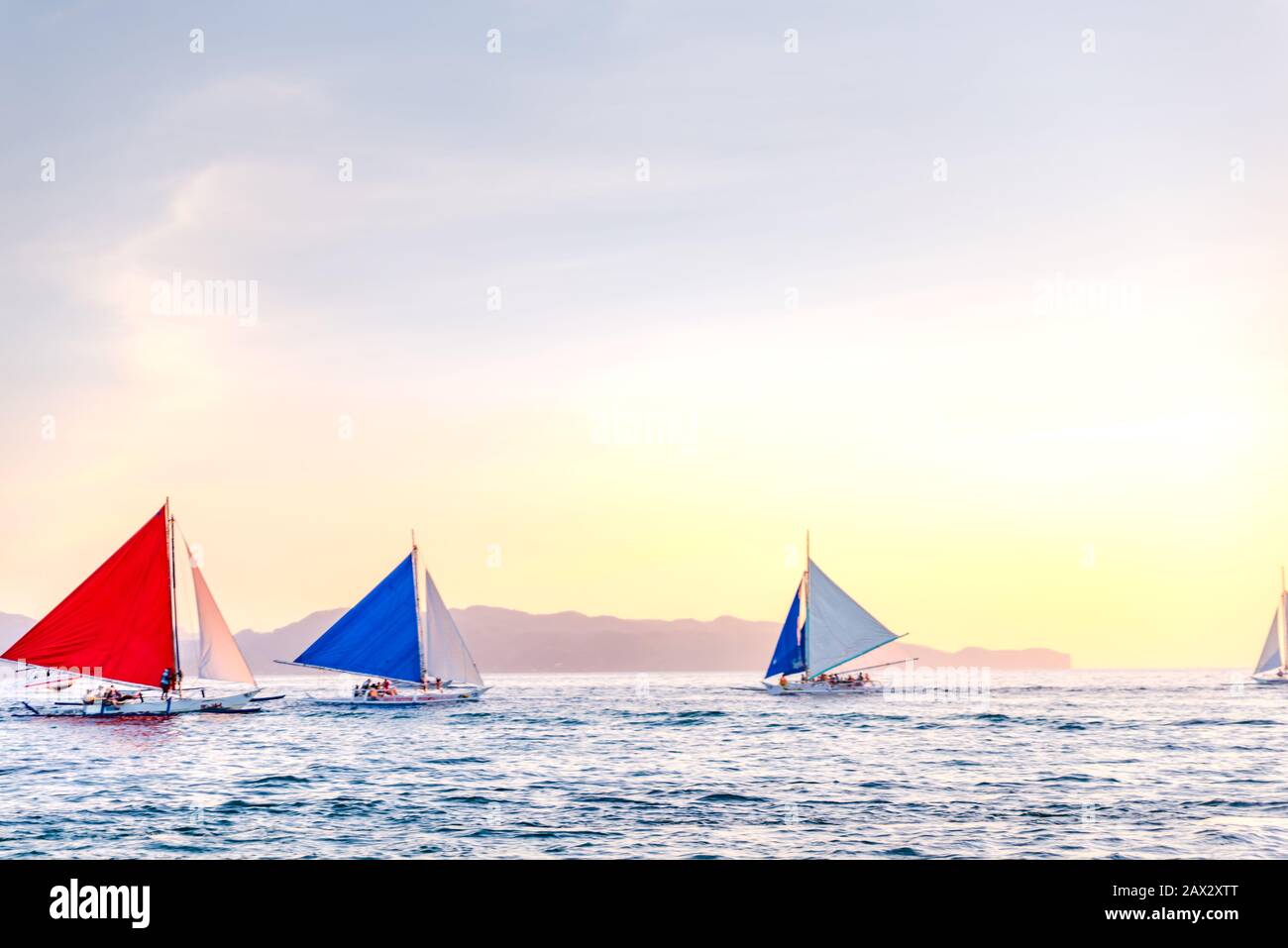 Boracay Island, Aklan, Philippines - Visitors enjoy sunset in a ...