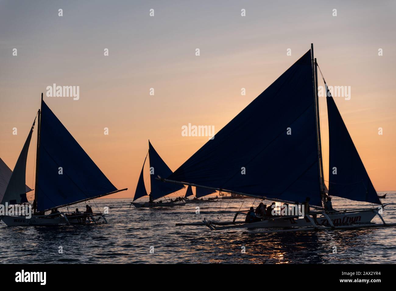 Boracay Island, Aklan, Philippines - Visitors enjoy sunset in a ...