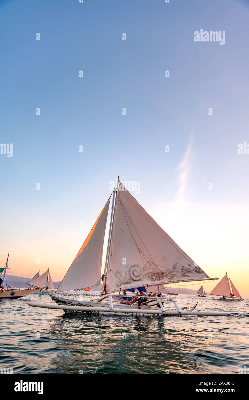 Boracay Island, Aklan, Philippines - Visitors enjoy sunset in a ...