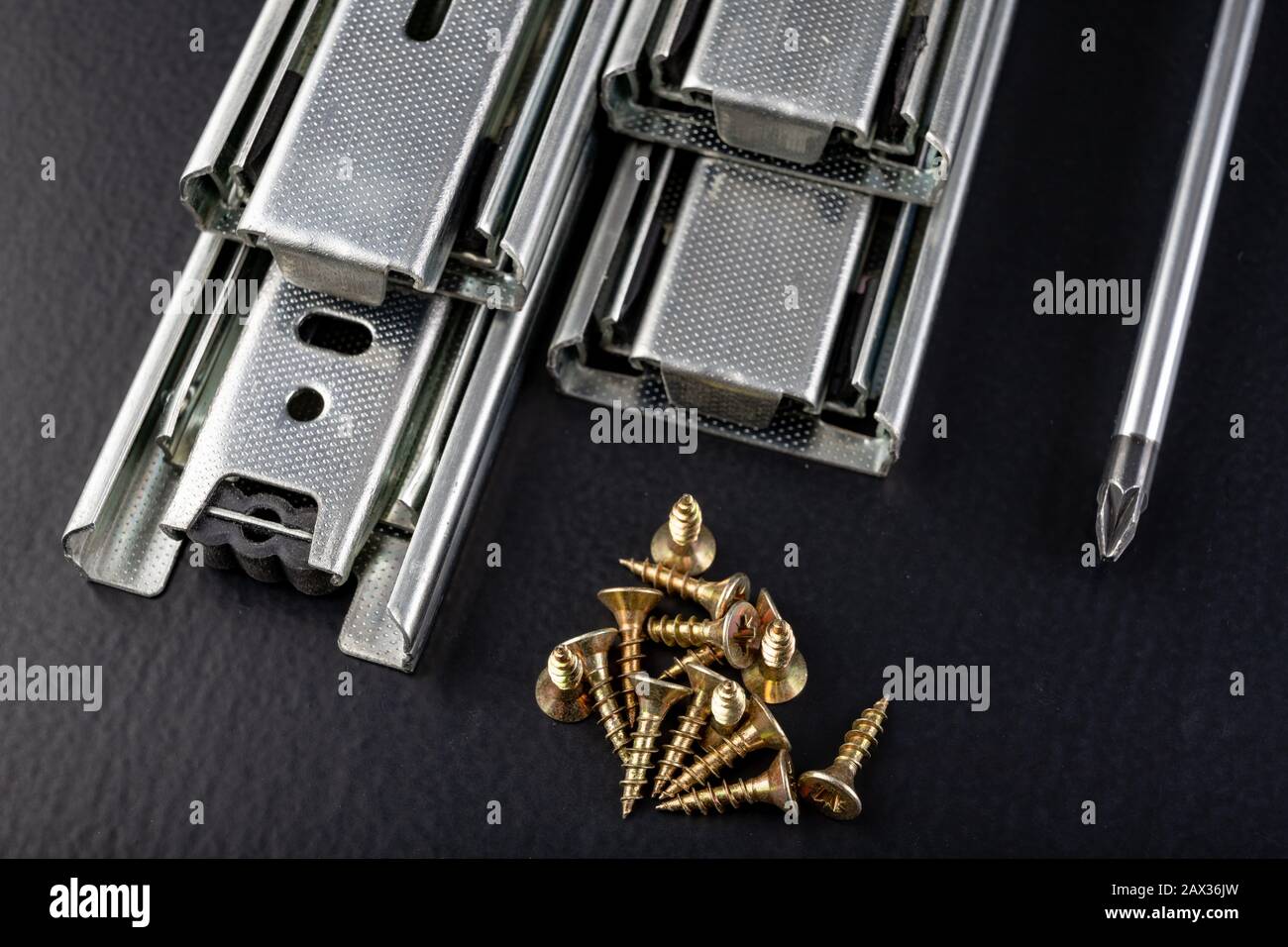 Silver roller guide used in carpentry. Furniture accessories on a ...