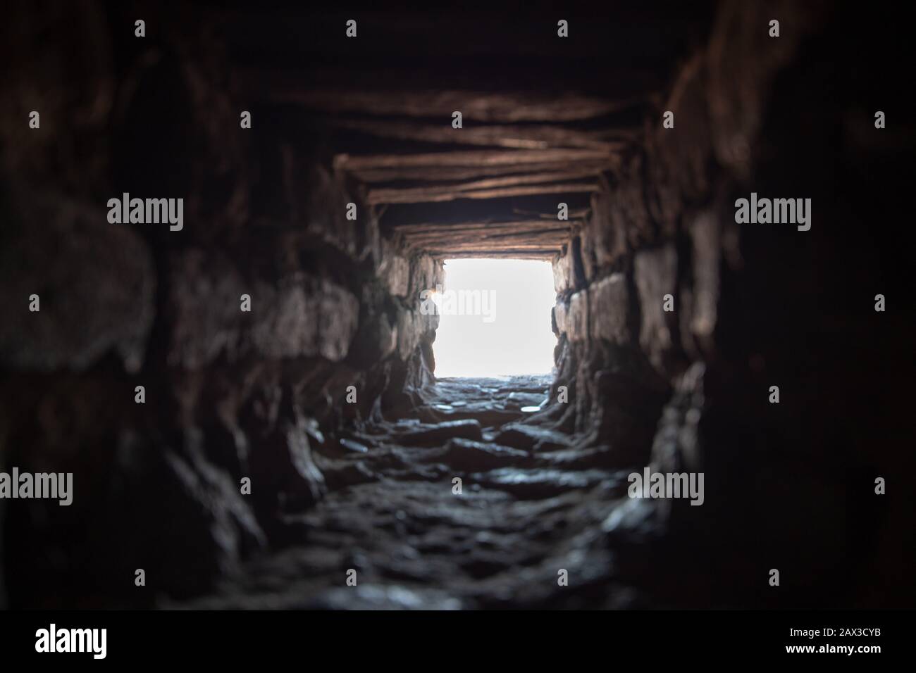 Looking through a hole through the wall from inside Asinelli Tower in ...