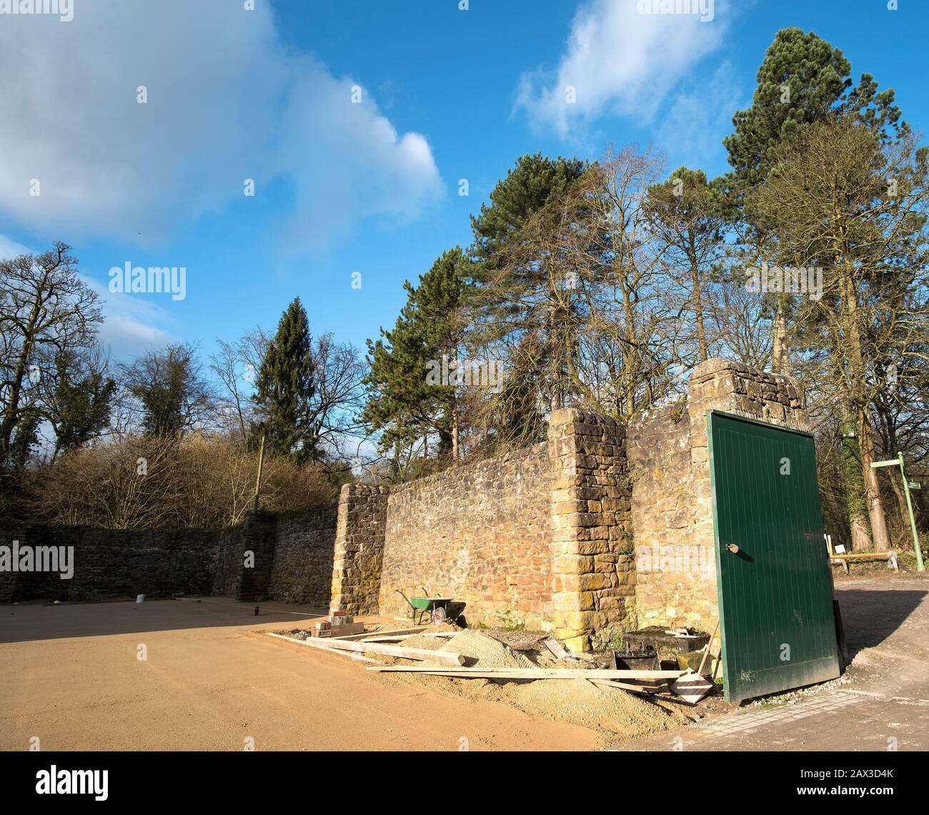 Construction tools next to a stone wall Stock Photo - Alamy