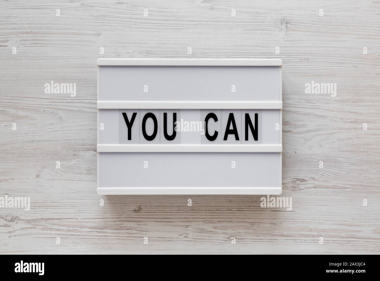 'You can' words on a modern board on a white wooden background, top ...