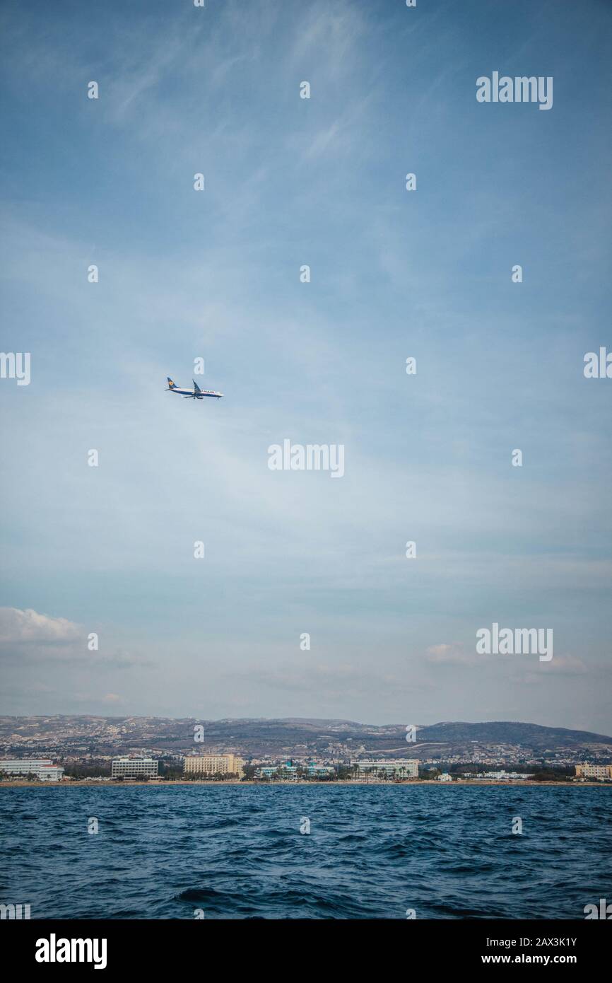 Wing of aeroplane over ocean island hi-res stock photography and images ...
