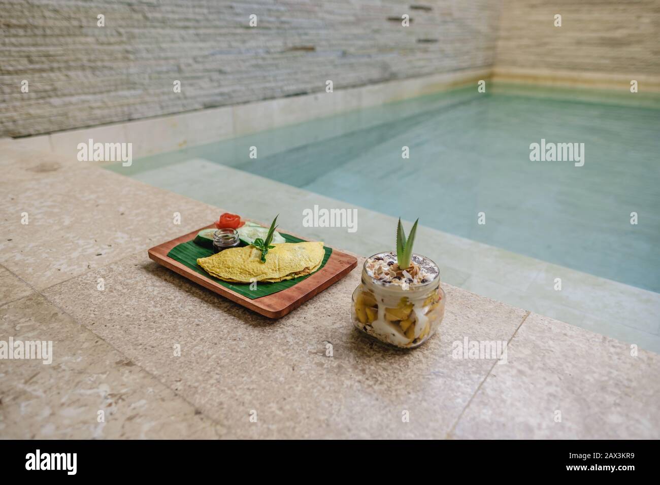 Wide angle shot of a tray of food next to ice cream in front of the ...