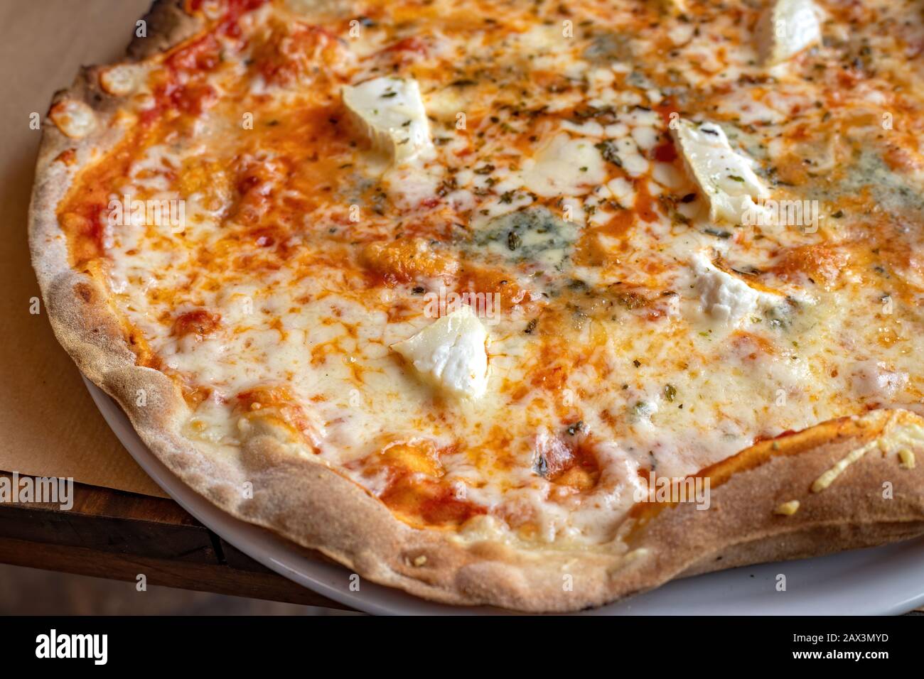 Delicious cheese pizza close-up in restaurant Stock Photo - Alamy