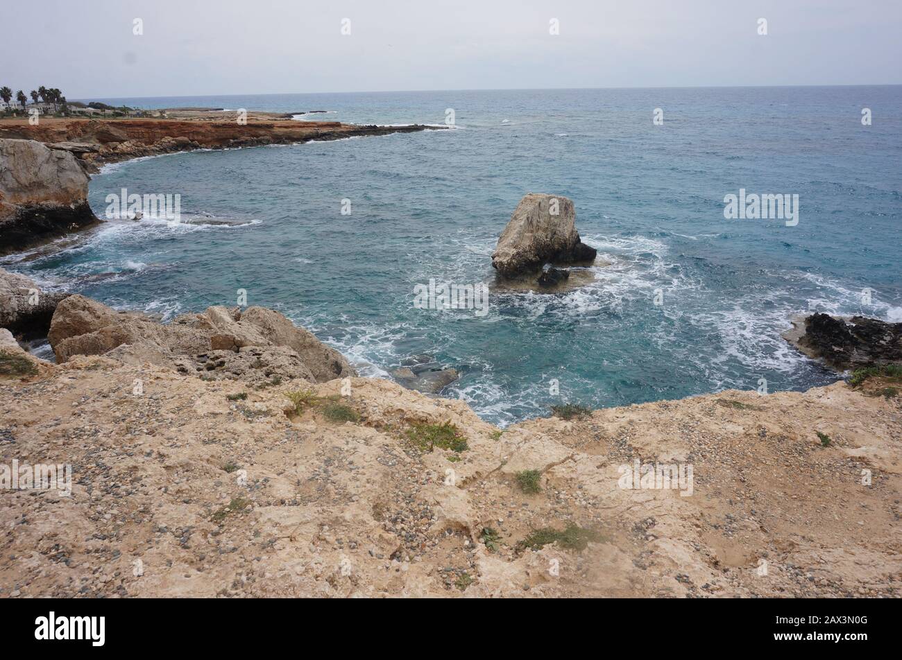 Rocks and a blue sea in Cyprus during daytime Stock Photo - Alamy