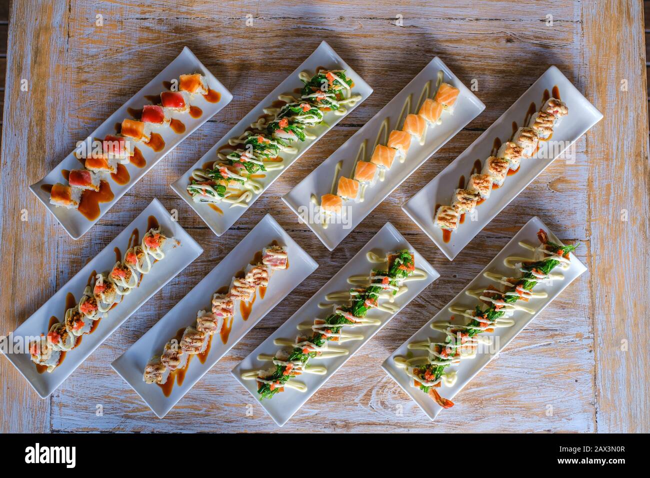 High angle shot of different trays of sushi next to each other Stock ...