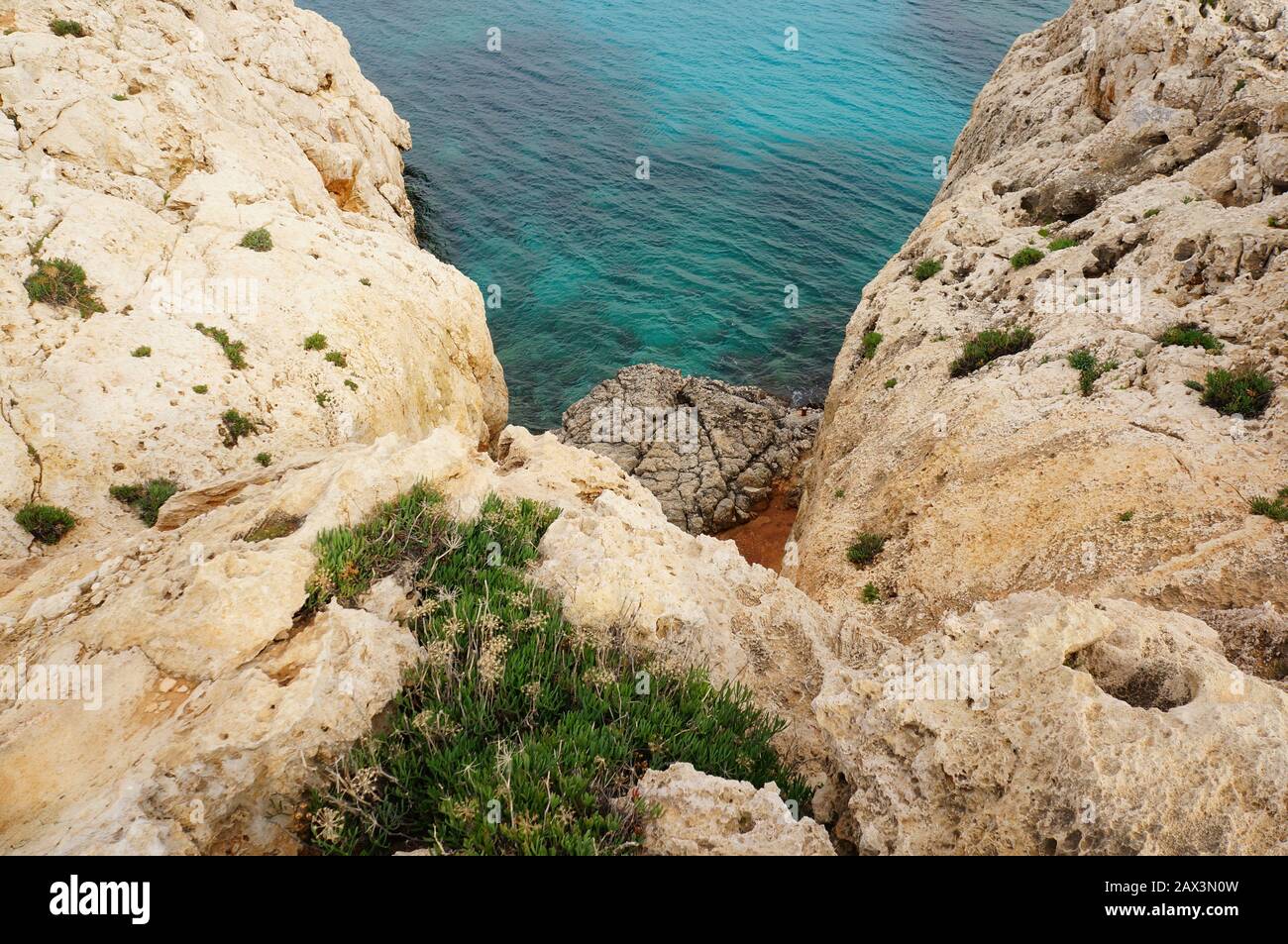 Rocks and a blue sea in Cyprus during daytime Stock Photo - Alamy