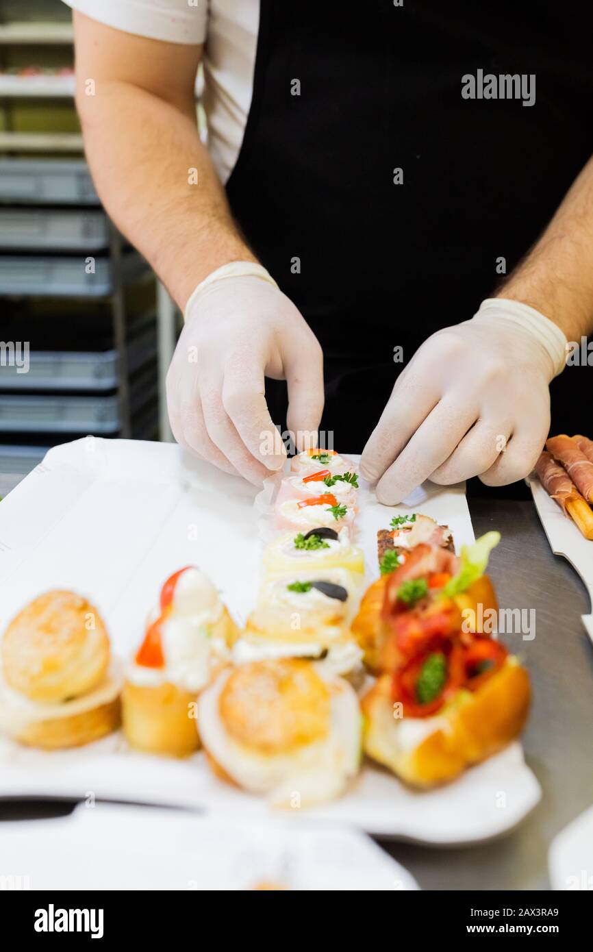 Man preparing meat snacks on hi-res stock photography and images - Alamy