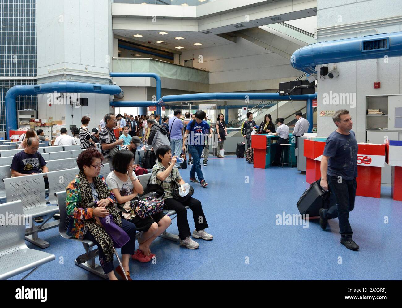 Passengers at the Hong Kong Macau ferry terminal, Hong Kong, China ...
