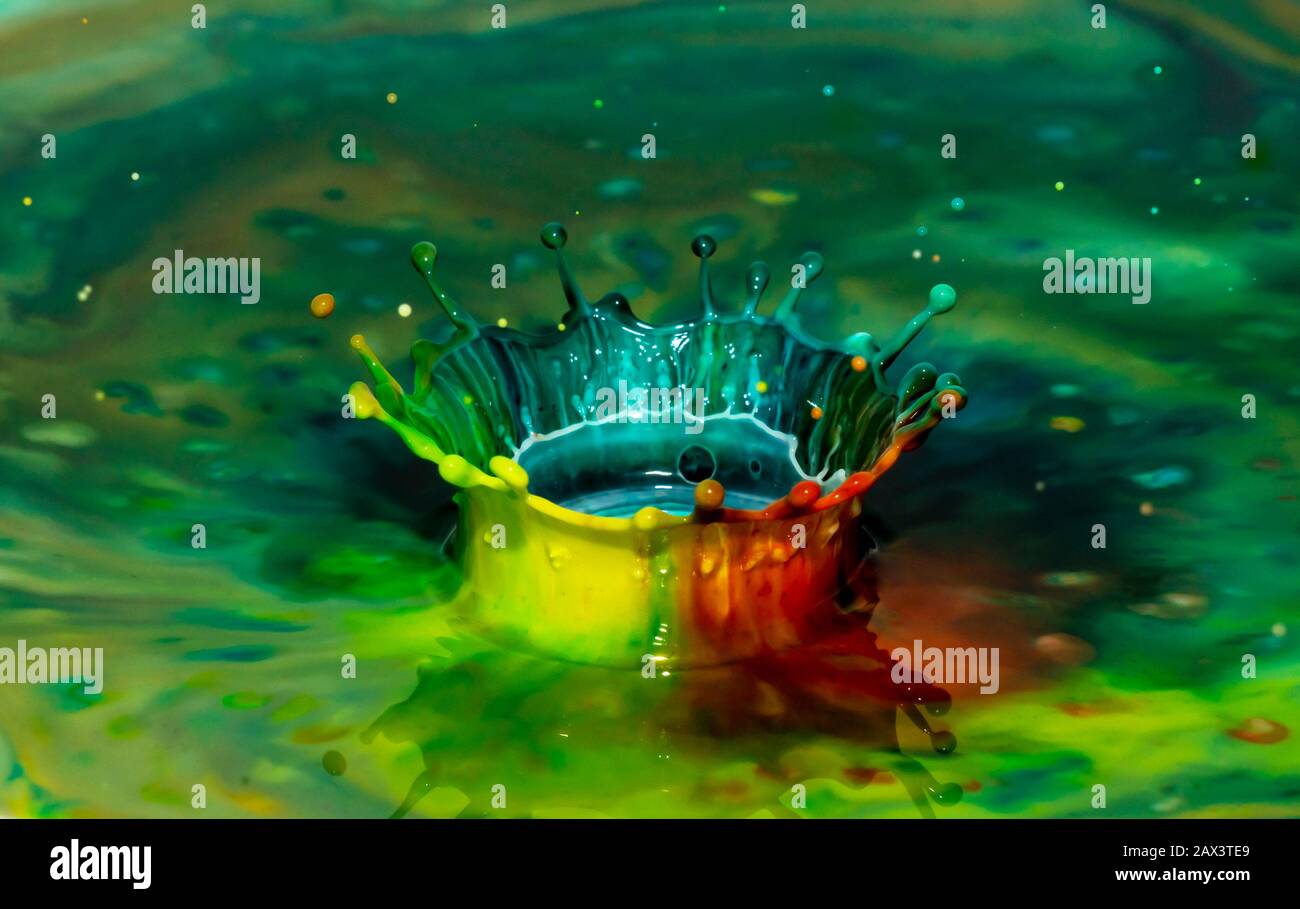 Bursts of multi-colored bright colors of paint in the form of crowns ...
