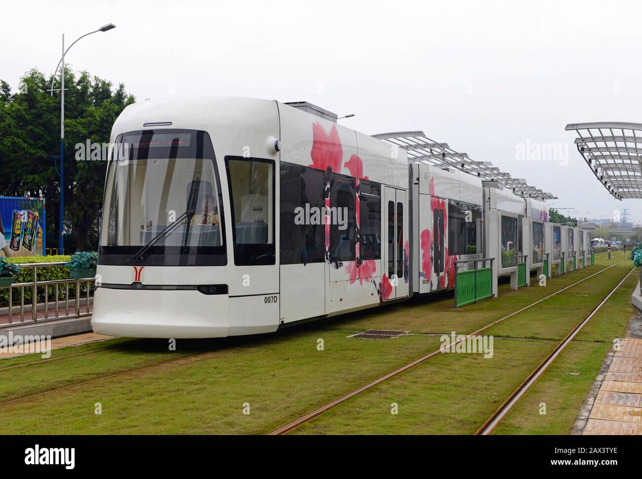 A tram waits at a station on the Haizhu tram system in Guangzhou, China ...