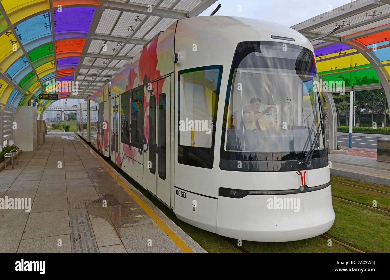 A tram waits at a station on the Haizhu tram system in Guangzhou, China ...