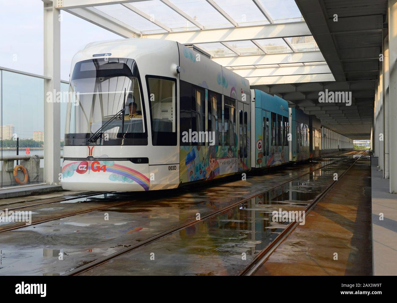 A tram travels on the Haizhu tram system in Guangzhou, China Stock ...