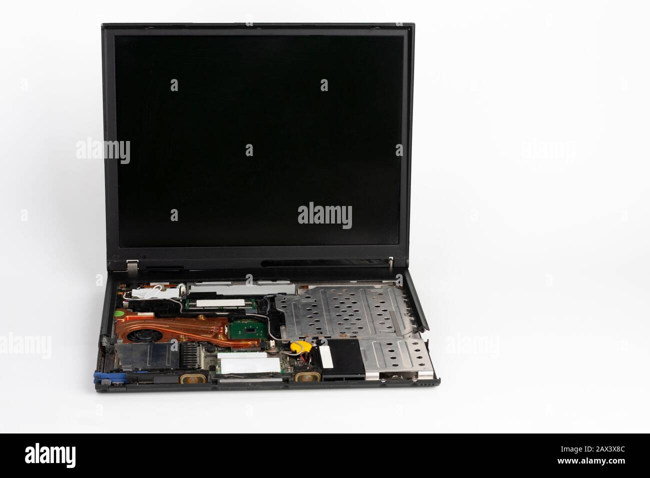 Old laptop, removed keyboard, hard disk drive, cd drive and battery on ...