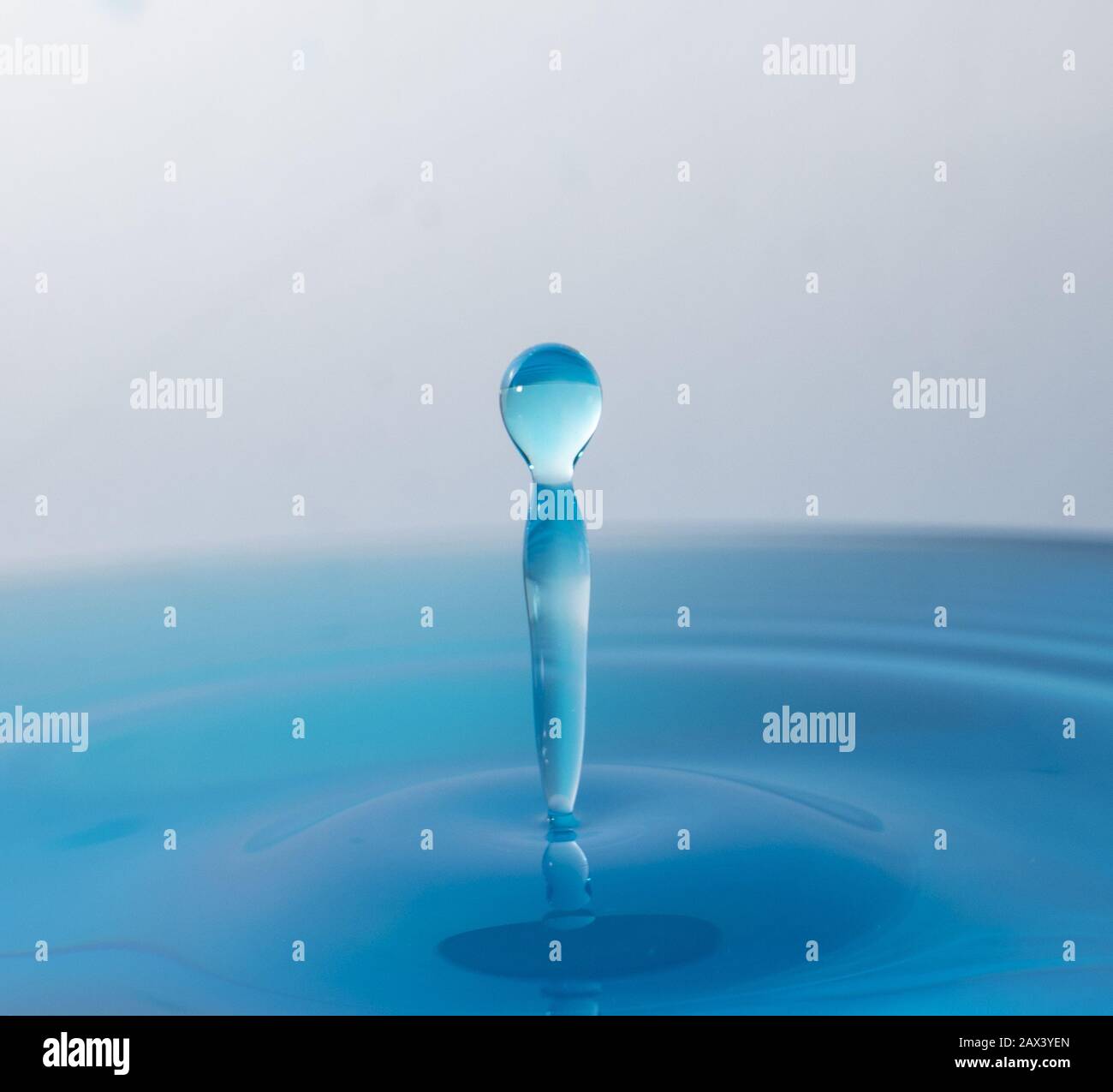 Water drop effect in light blue color tone in white background Stock ...