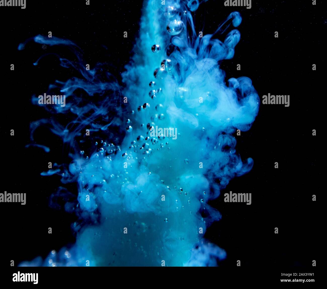 Abstract concept of blue color ink drop plume in water isolated on ...