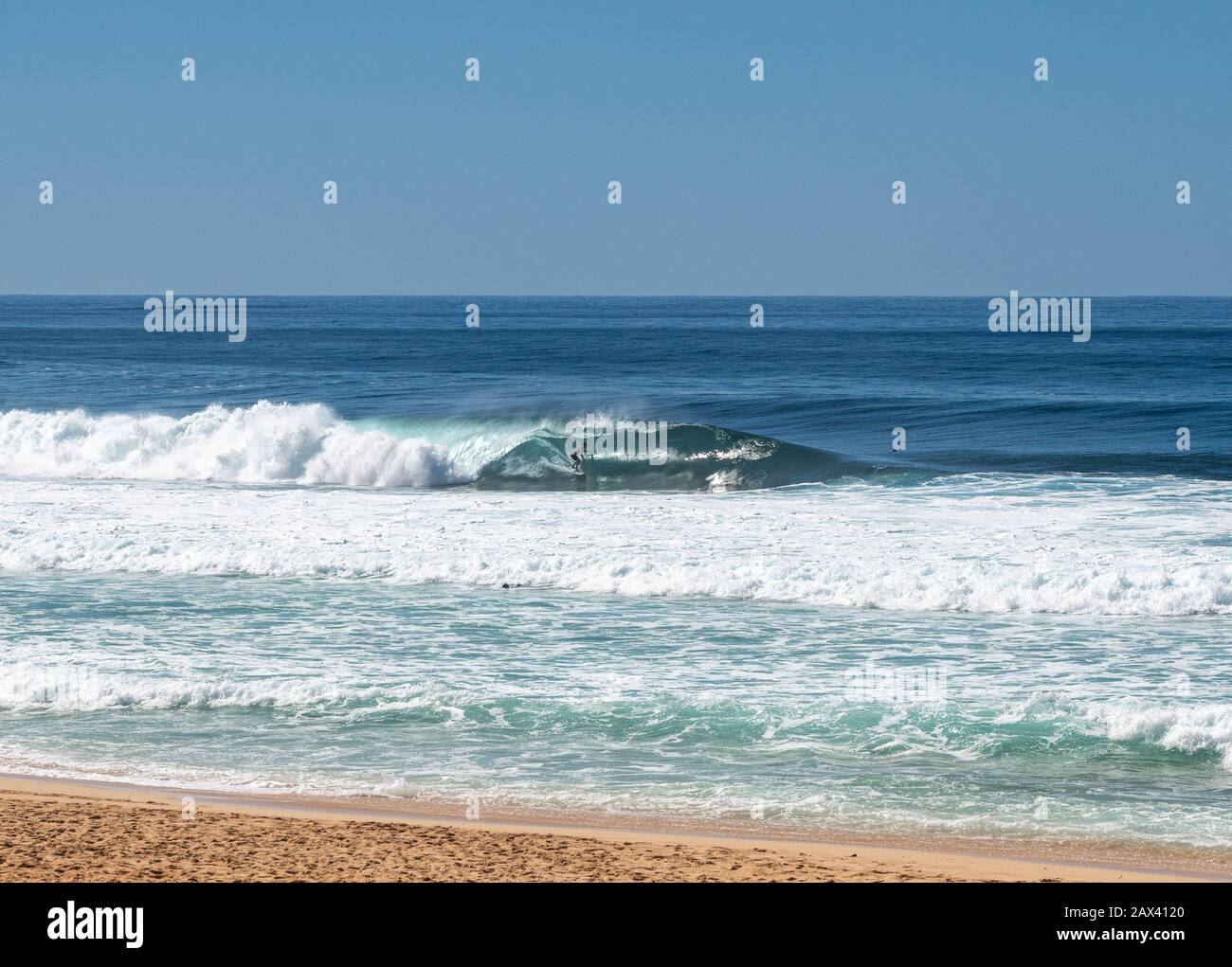 Surfer inside a big wave in the sea at Banzai Pipeline on north coast ...