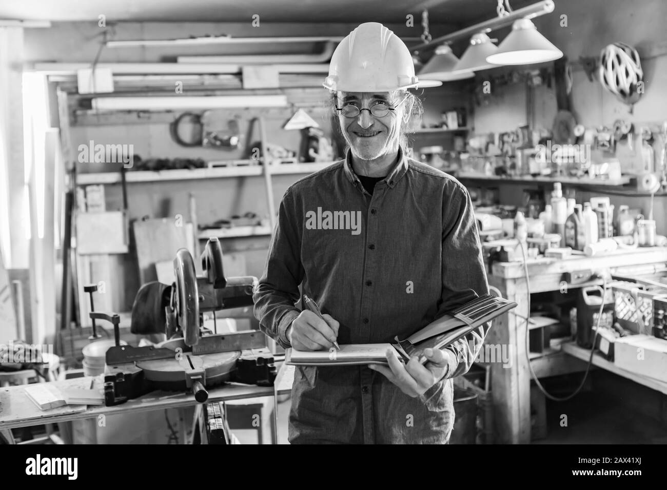 Inspector in the garage during an inspection. middle aged caucasian man ...