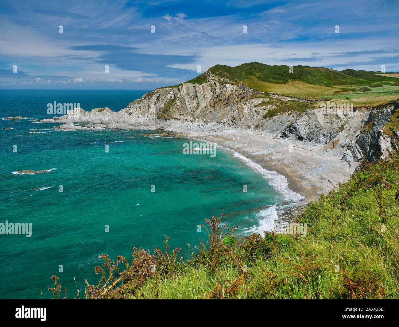 The north Devon coast at Rockham Beach showing steeply inclined slate ...
