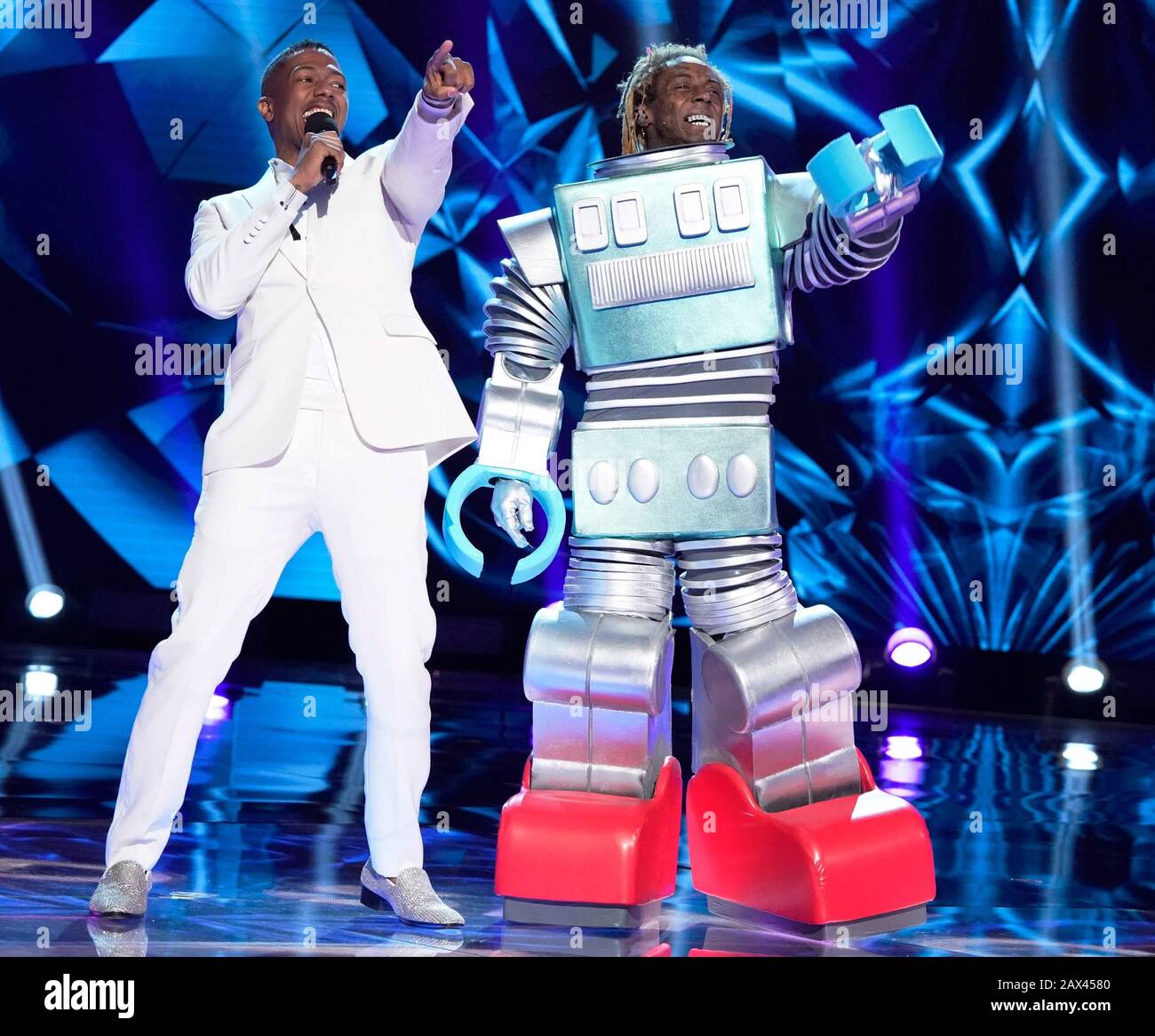 THE MASKED SINGER, host Nick Cannon, Lil Wayne (revealed as The Robot ...