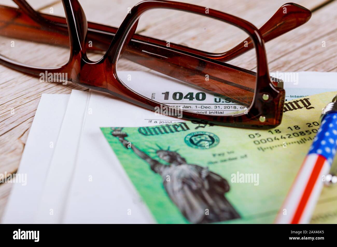 Tax 1040 forms with pen with U.S. individual income tax and glasses ...