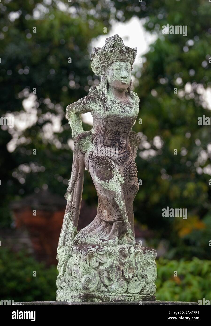A stone statue of a female Hindu God or diety. Bali, Indonesia. cutout ...